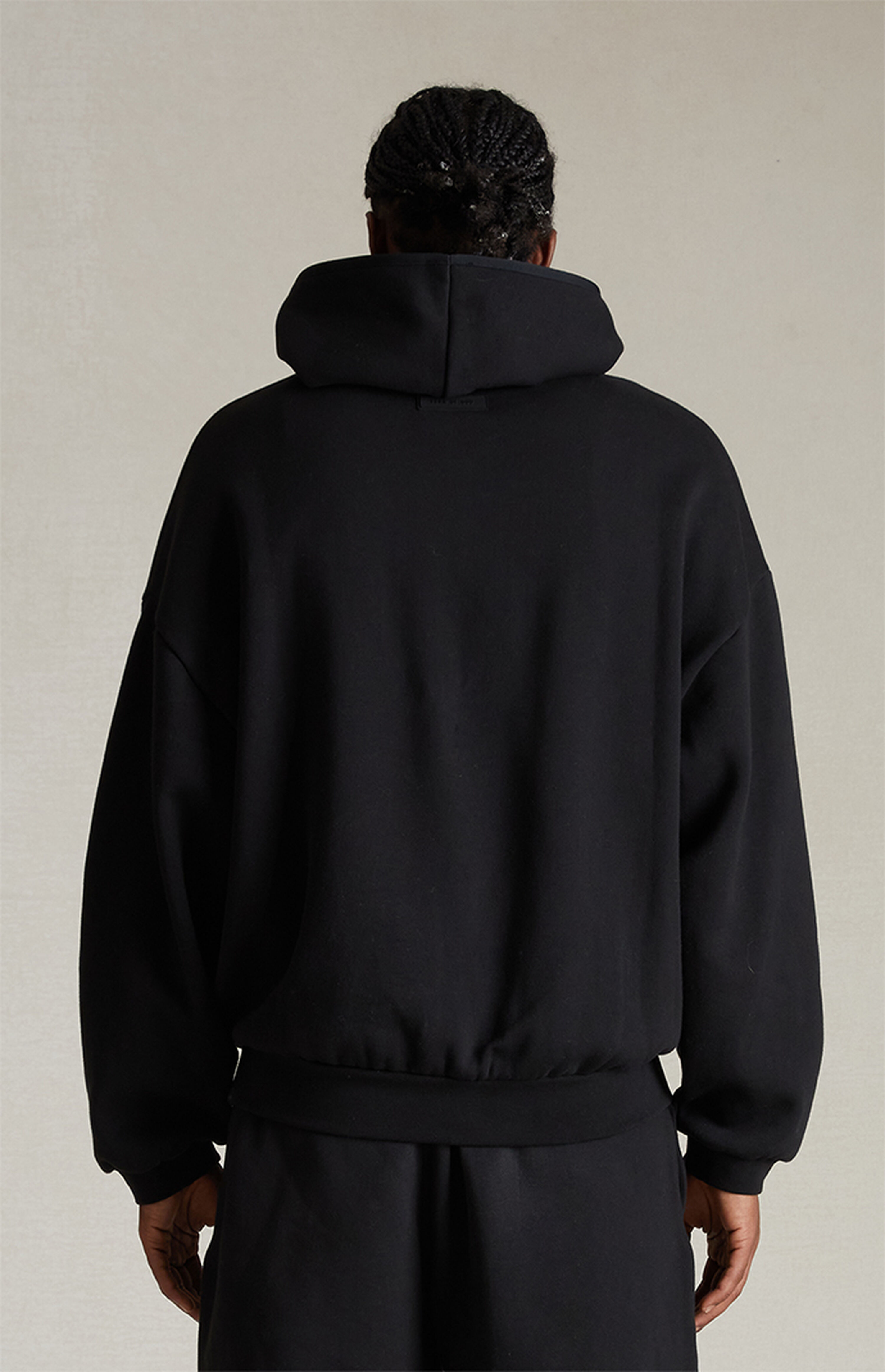 Fear of God ESSENTIALS Jet Black Hoodie | PacSun