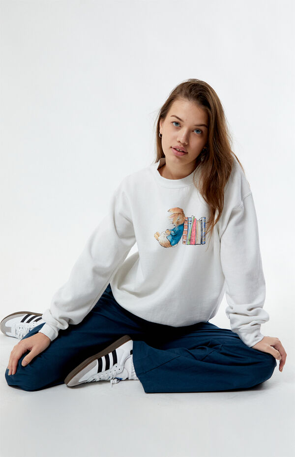 Peter Rabbit Sleeping Books Crew Neck Sweatshirt | PacSun