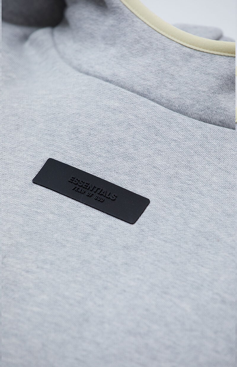 Fear of God ESSENTIALS Light Heather Grey Hoodie | PacSun