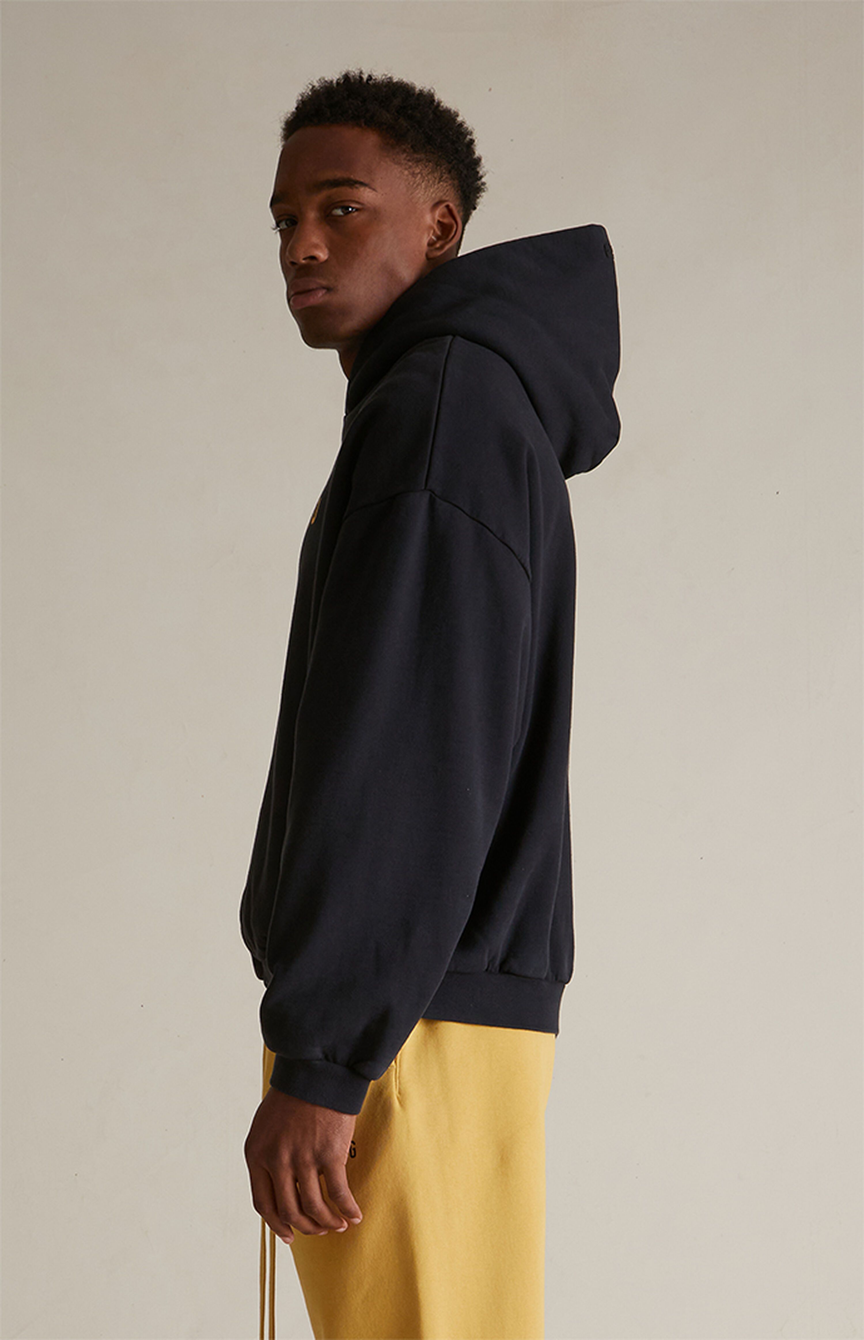 Fear of God ESSENTIALS Black Heavy Fleece Hoodie | Pacsun