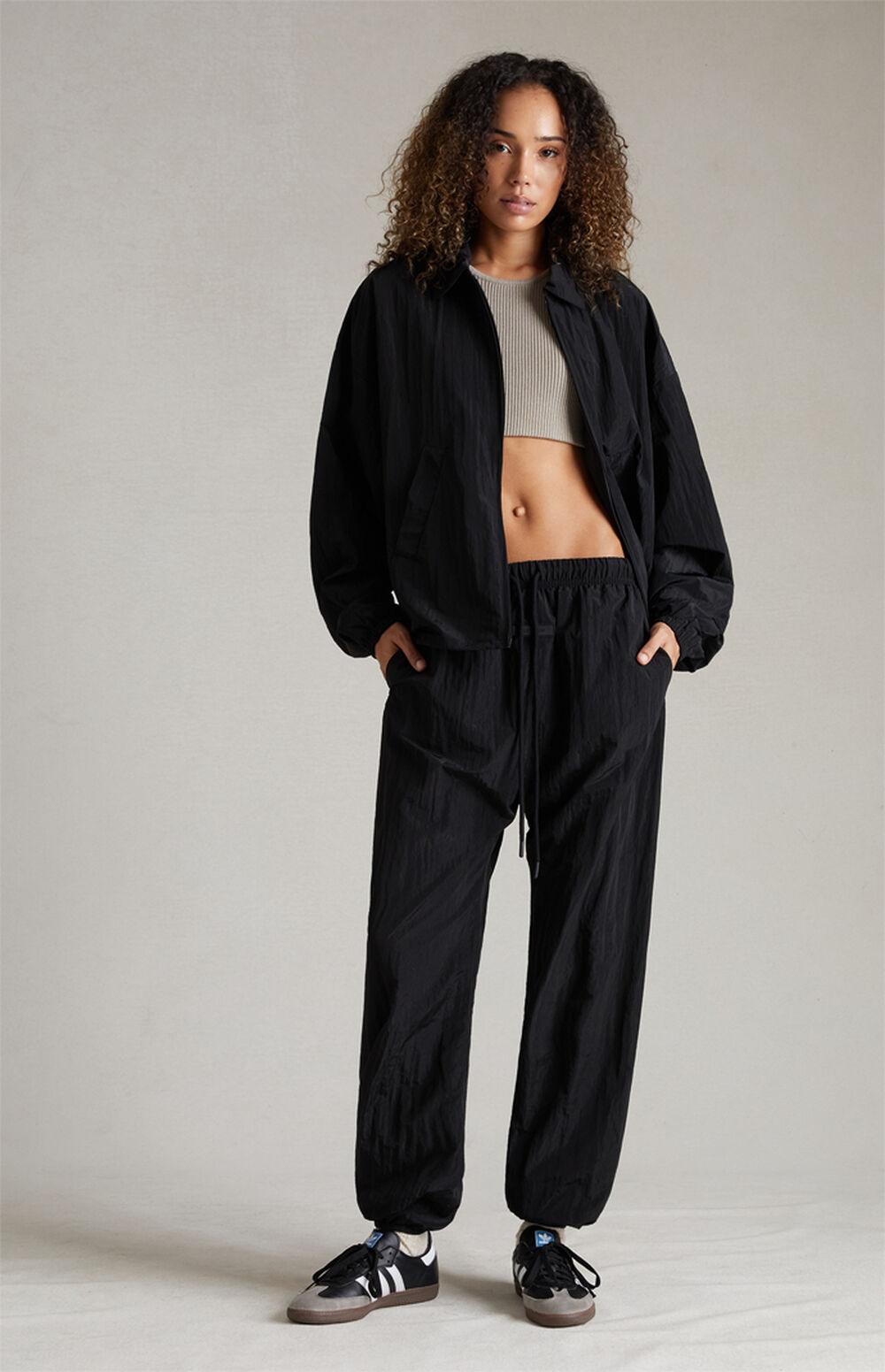 Fear of God Essentials Women's Jet Black Crinkle Nylon Track Pants | Pacsun