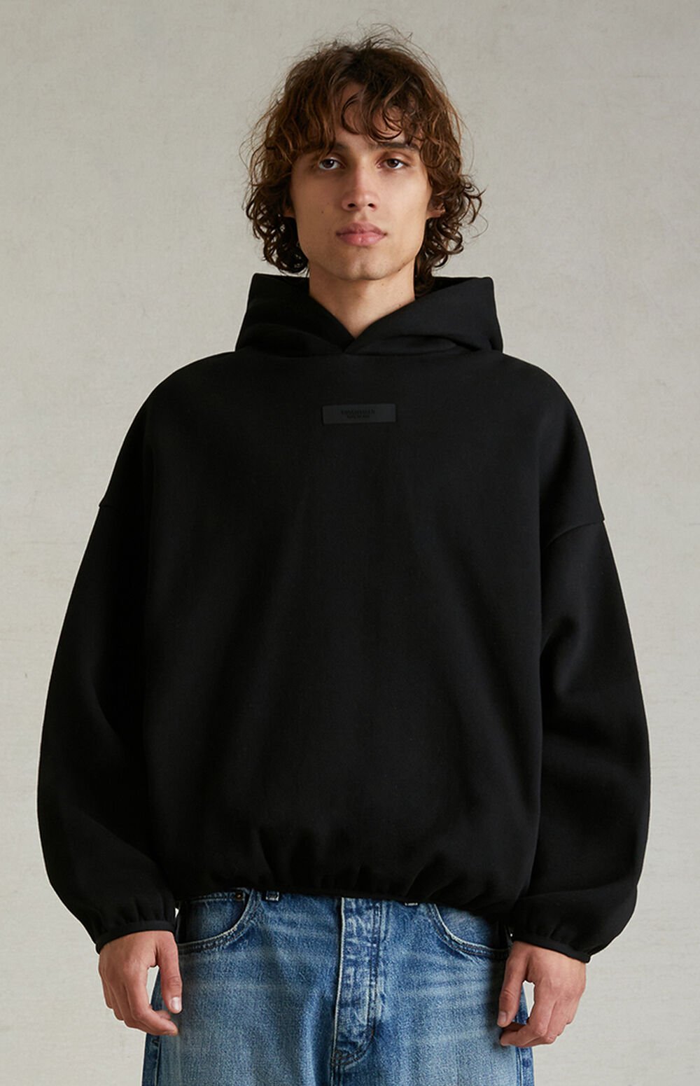 Fear of God ESSENTIALS Black Hoodie | PacSun