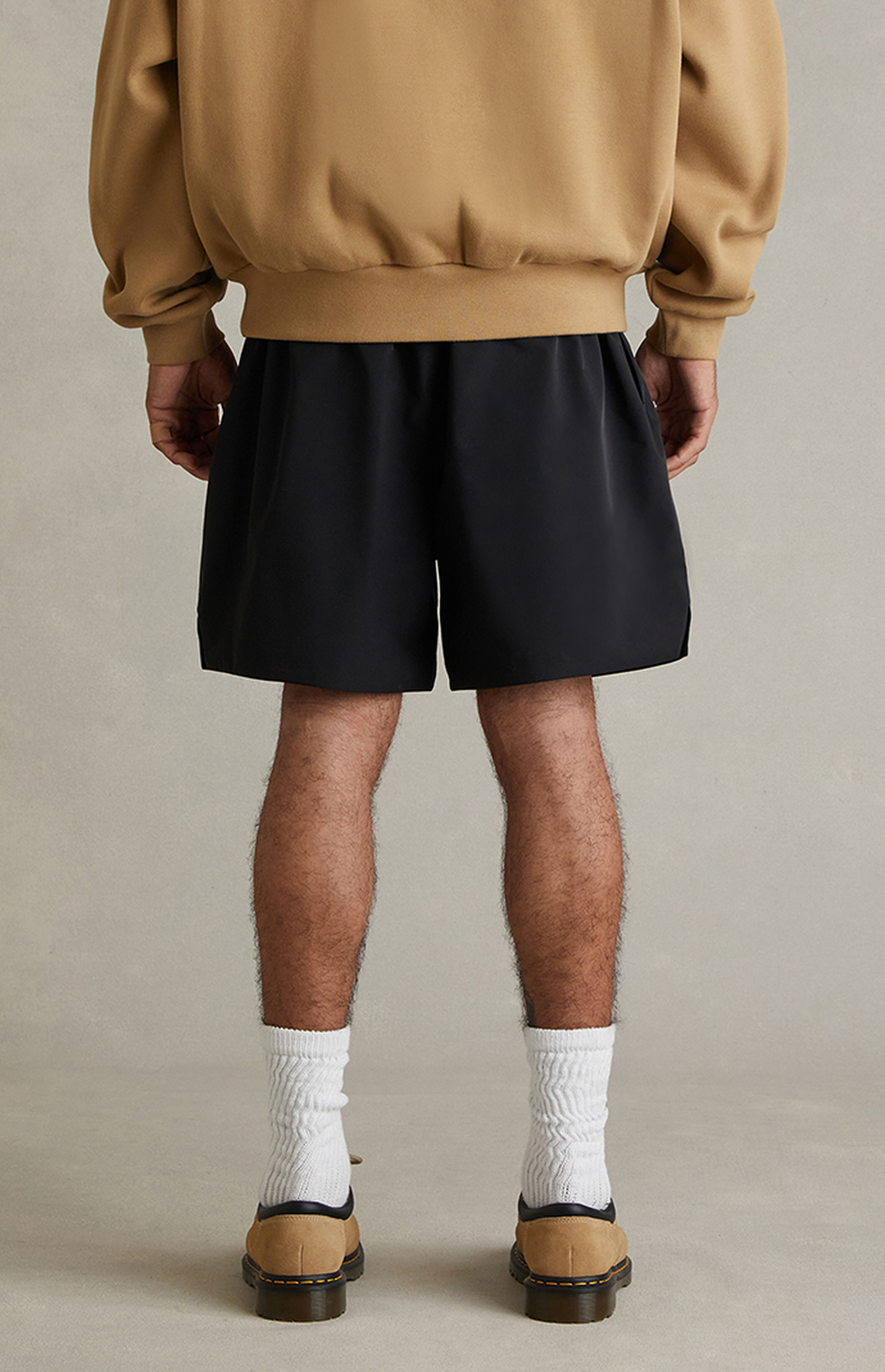 Fear of God ESSENTIALS Vintage Black Active Trace Classic Shorts | Pacsun