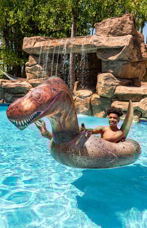 PoolCandy Tube Runner Motorized T-Rex Pool Float | PacSun