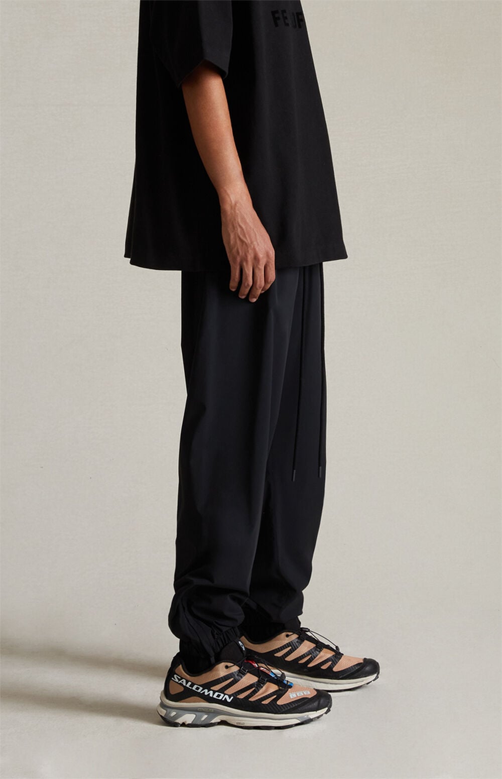 Fear of God ESSENTIALS Jet Black Nylon Track Pants | Pacsun