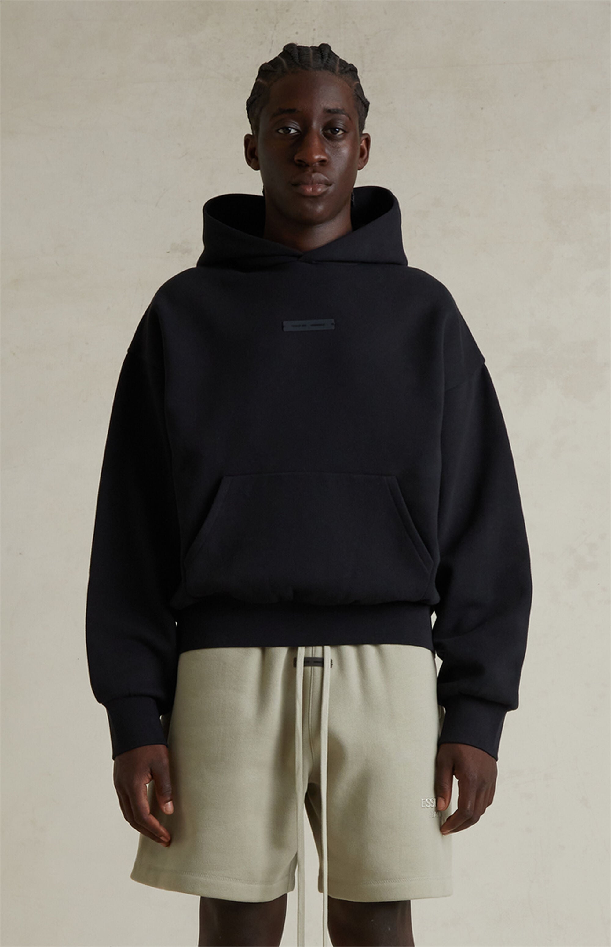 Fear of God ESSENTIALS Jet Black Classic Fleece Hoodie | Pacsun