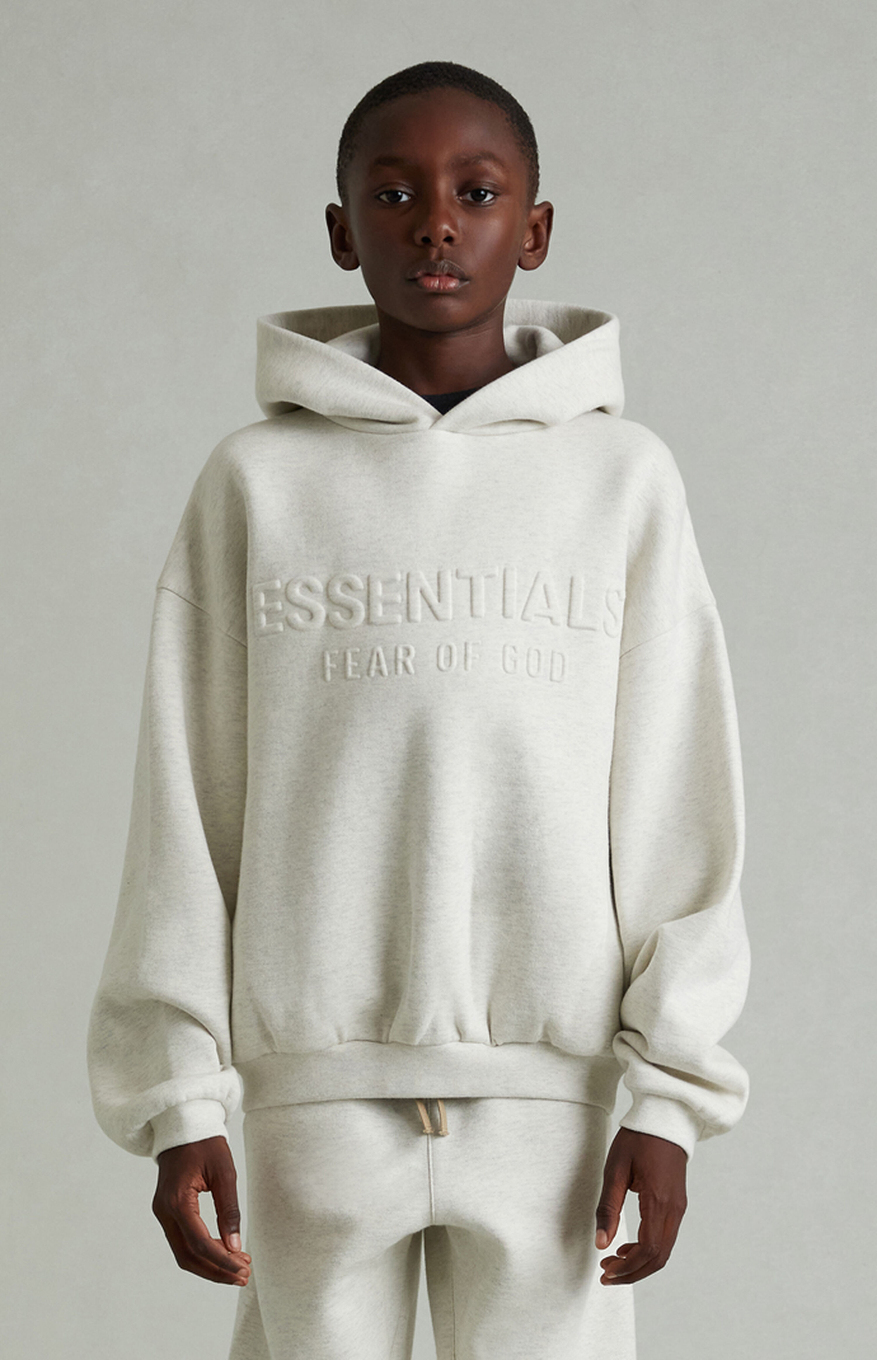 Fear of God ESSENTIALS Kids Heather Oatmeal Embossed Classic Hoodie ...