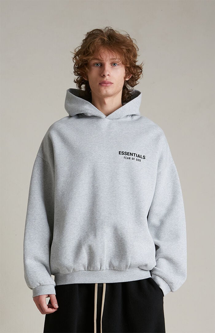 Fear of God ESSENTIALS Light Heather Grey Fleece Hoodie | PacSun